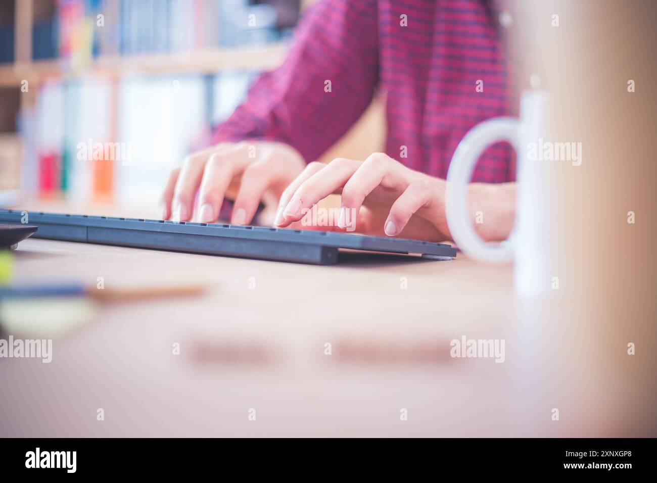 Typing hands on keyboard, home office with text space Stock Photo - Alamy