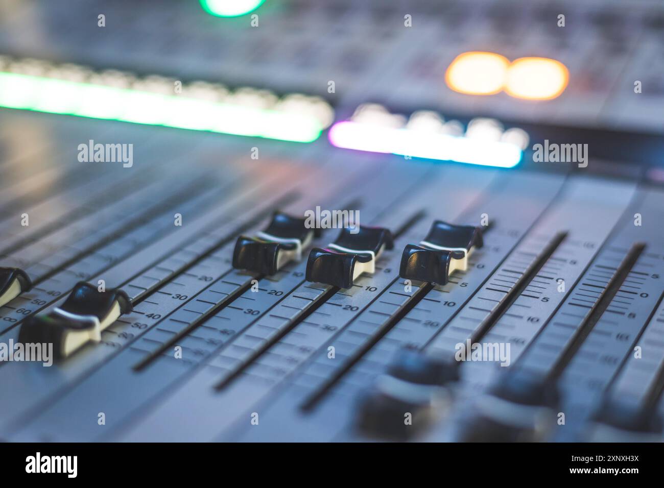 Professional music production in a sound recording studio, mixer desk ...