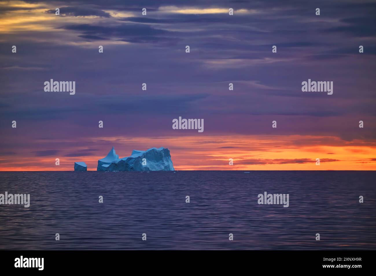 Iceberg against orange sunset sky, Antarctica, Polar Regions Copyright ...
