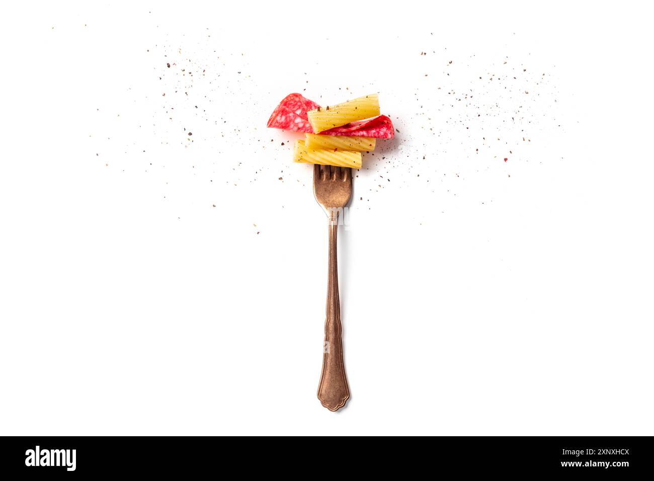 Italian pasta. A vintage fork with penne pasta, on a white background ...