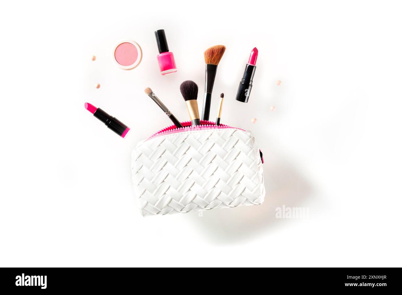 Professional makeup, flying out of a pouch, on a white background Stock ...