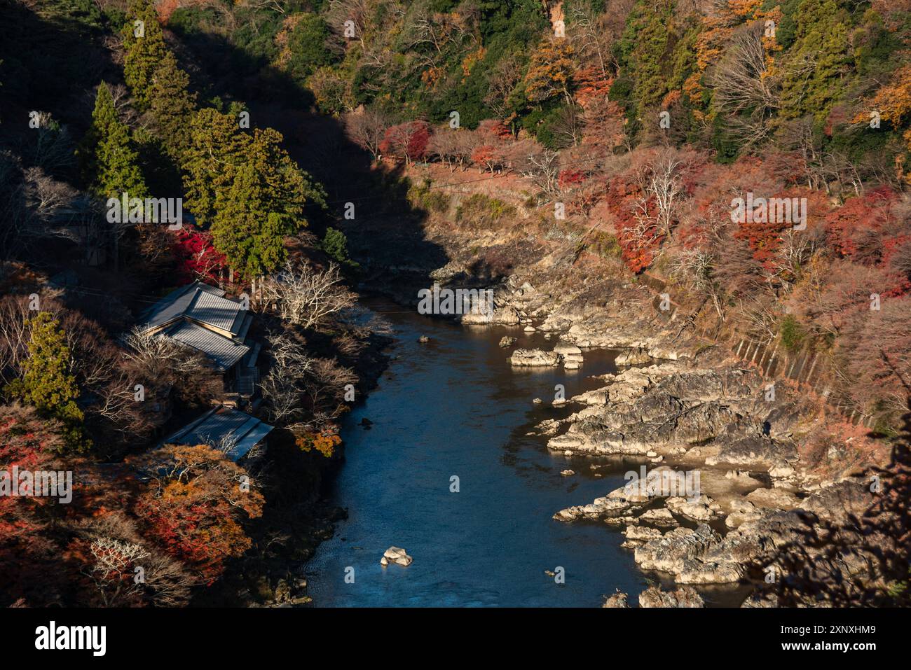Autumnal forests with deep blue Katsura River in Arashiyama of Kyoto ...