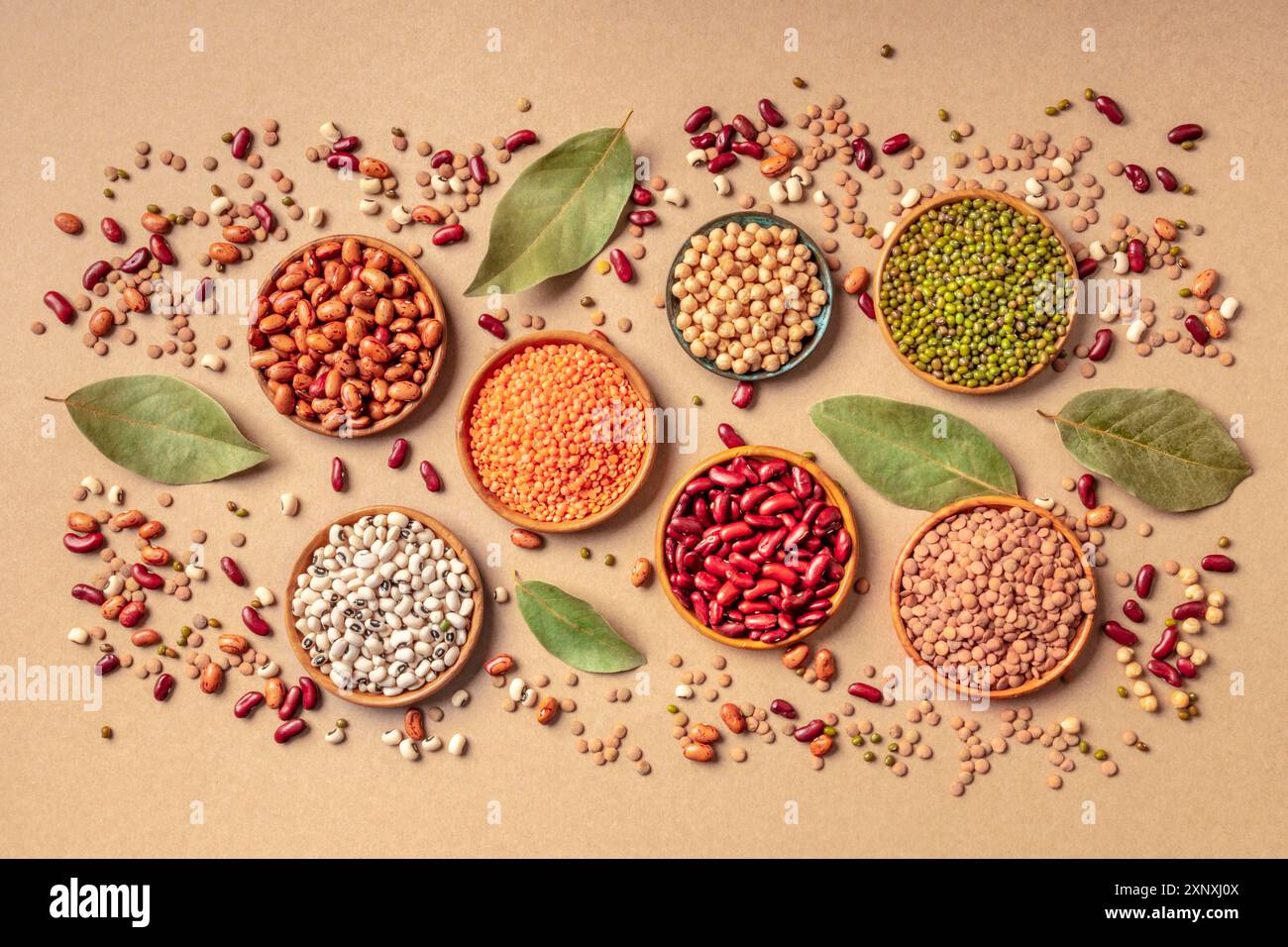 Legumes assortment, shot from the top on a brown background. Lentils ...