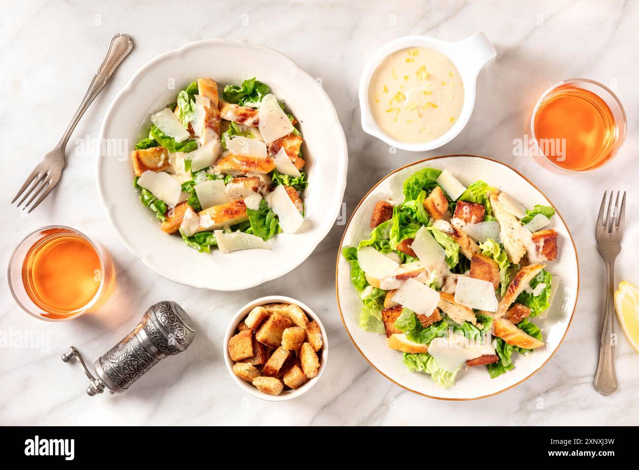 Caesar salad with the classic sauce and wine, shot from the top on a ...