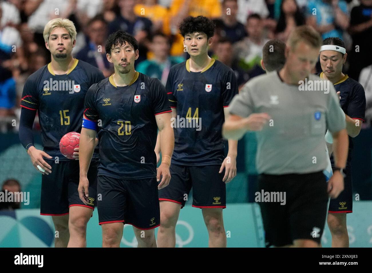 Japan players react after losing against Slovenia during a men's ...