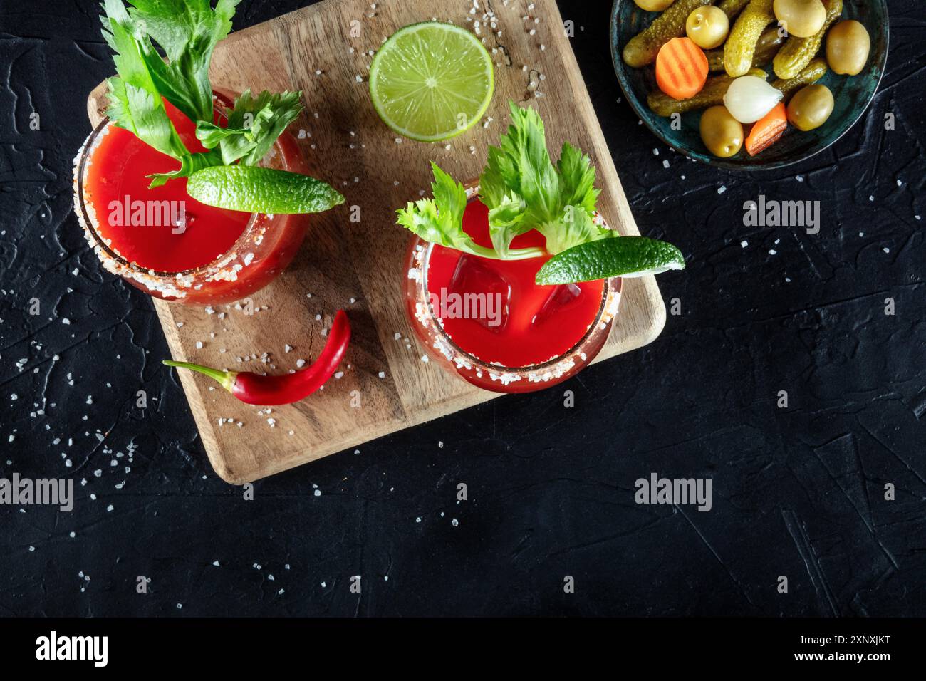 Bloody Mary cocktails, overhead flat lay shot with a place for text ...