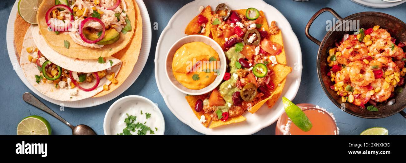 Mexican food panoramic header on a blue background. Nachos with chili ...