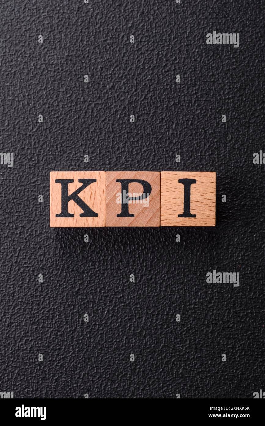 Inscription KPI Key Performance Indicator with wooden cubes, conceptual ...