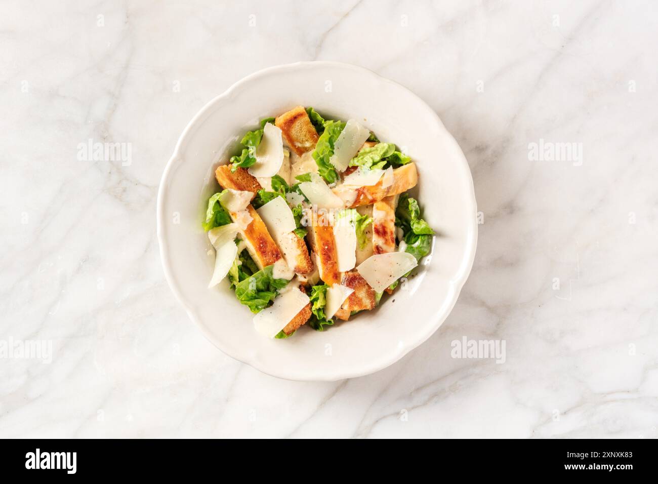 Caesar salad with grilled chicken meat, green romaine salad and ...