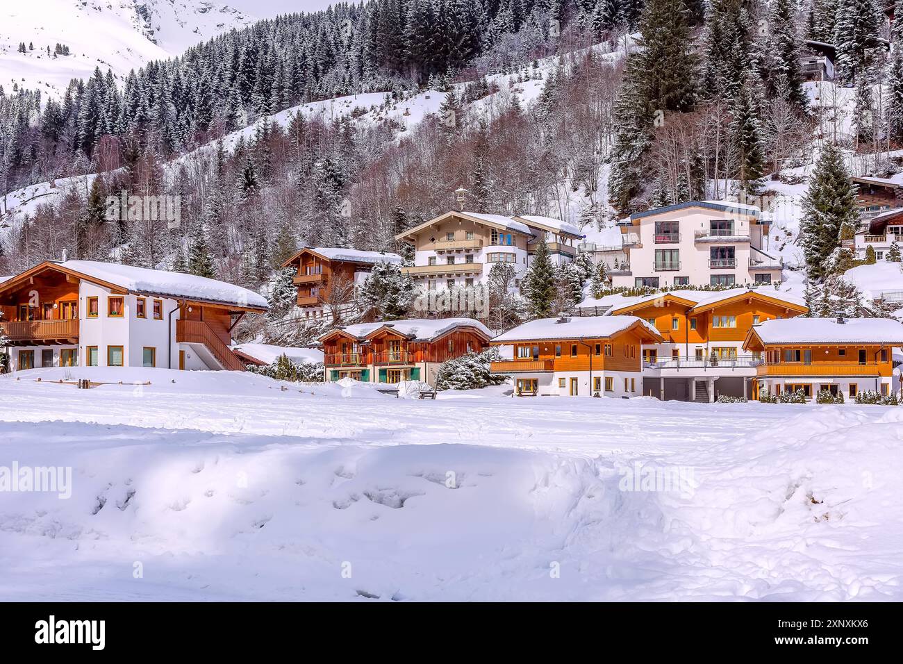 Winter snow mountain village panorama with wooden traditional houses in ...