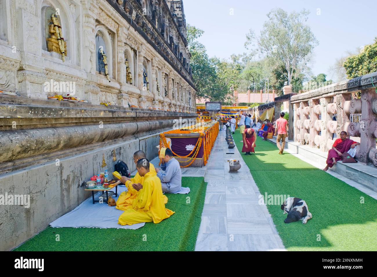 Flower offerings and devotees in the Cloister Walk of the Buddhist ...