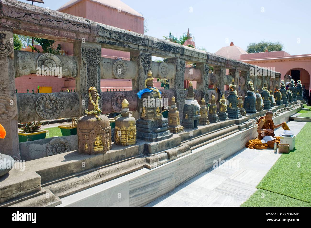 Antique votive stupas line the Chankramana Walk adjacent to the ancient ...