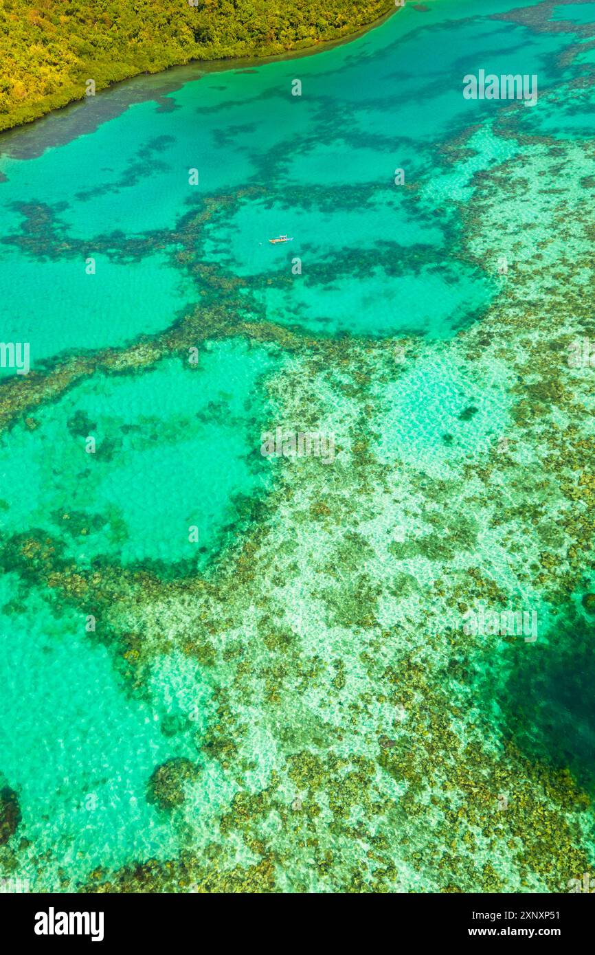 Bangka boat over coral, Chindonan Island, Calamian Islands, Coron ...