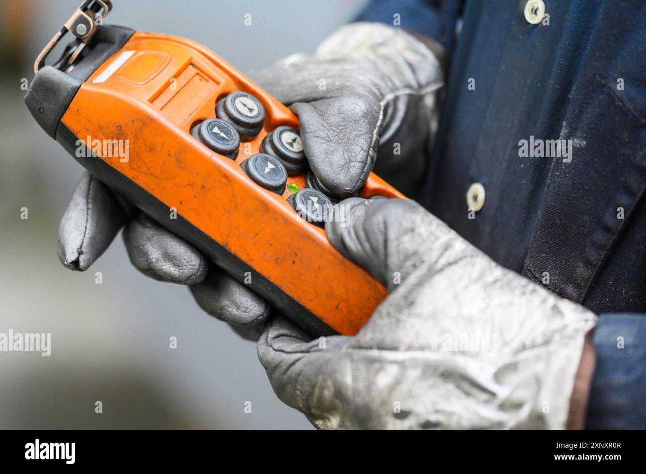 Male hand push remote control switch for overhead crane in the factory ...