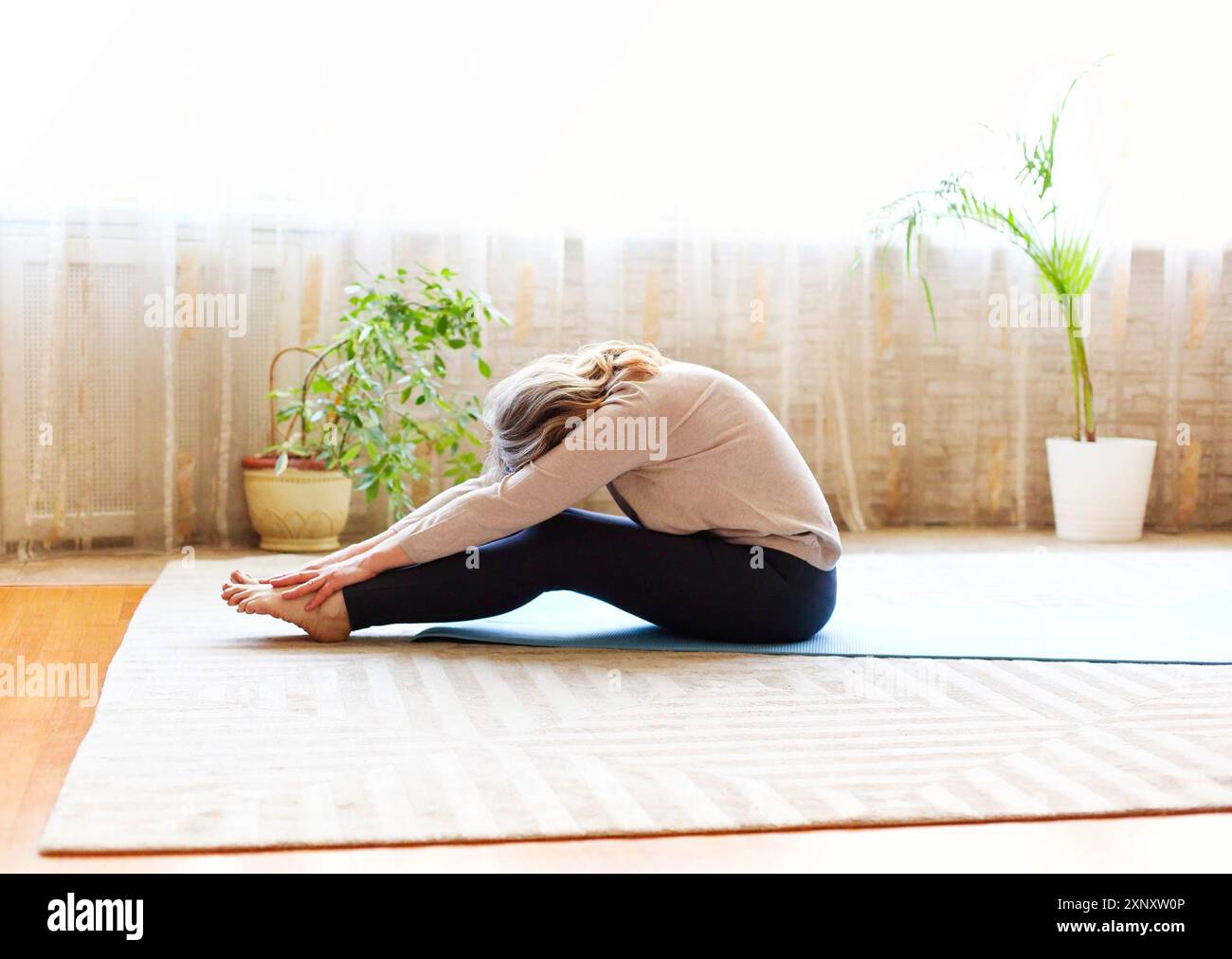 Full body adult female in casual clothes raising arms and stretching ...