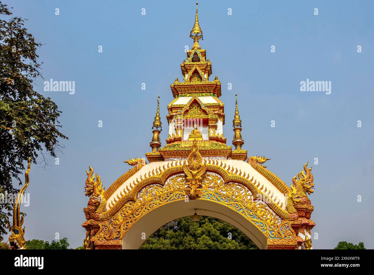 Decoration on the gate of Wat Khu Kum with the statues of Buddha, Naga ...