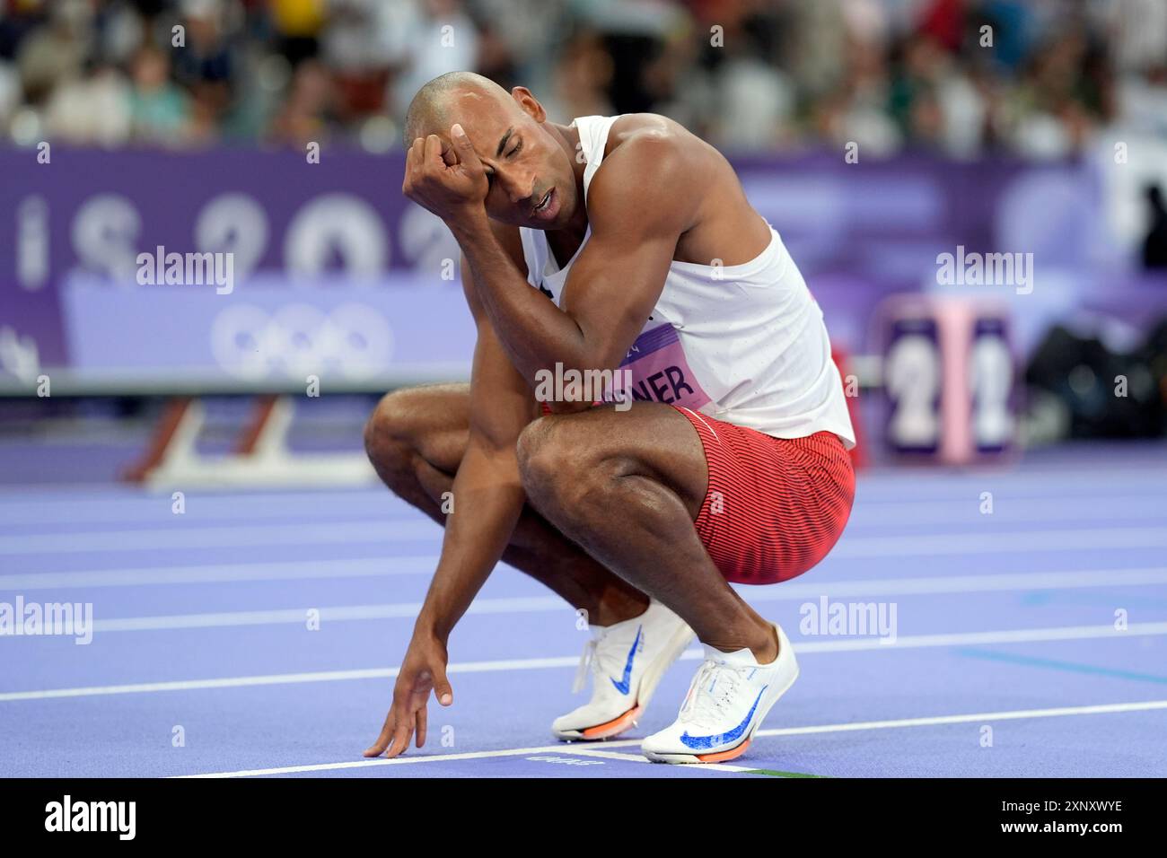 Damian Warner, of Canada, reacts after finishing the decathlon 400 ...