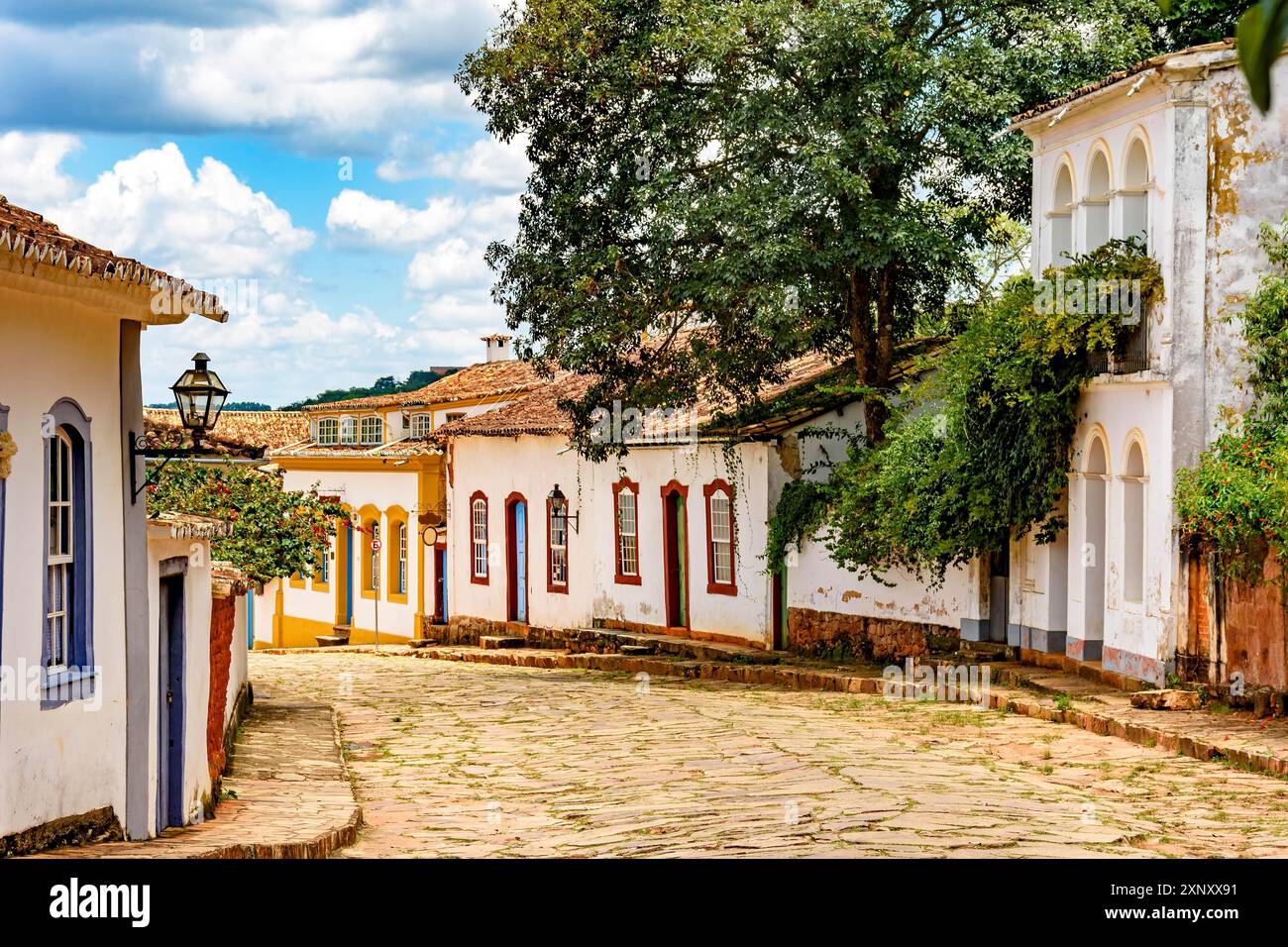 Street with cobblestones and some houses with colonial architecture in ...