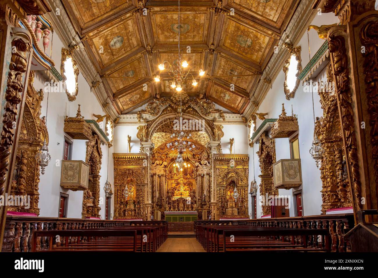 Interior and altar of historic church all painted in gold with baroque ...