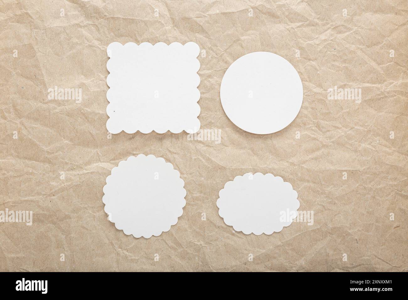 Mockup template of a group of white cardboard cards on crumpled paper ...