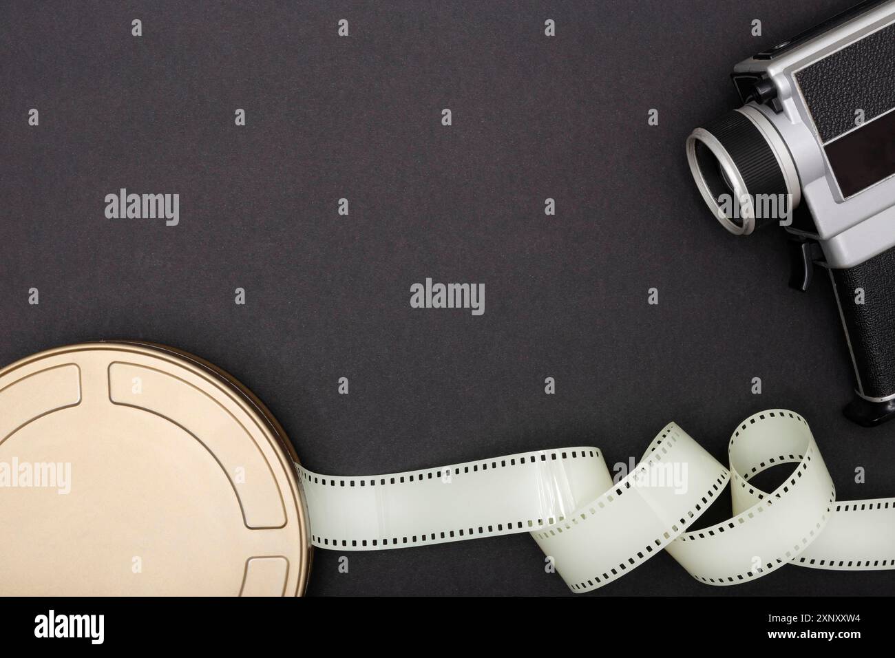 Motion Picture Film Can, film camera and film strip on black background ...