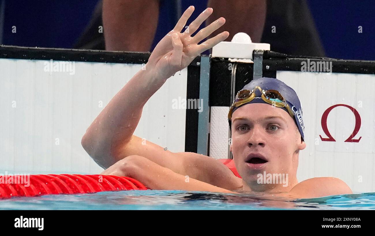 Leon Marchand of France, celebrates after winning the men's 200-meter ...