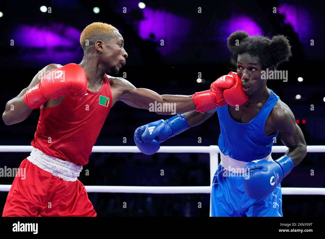 Zambia's Patrick Chinyemba hits Cabo Verde's David De Pina in their men ...