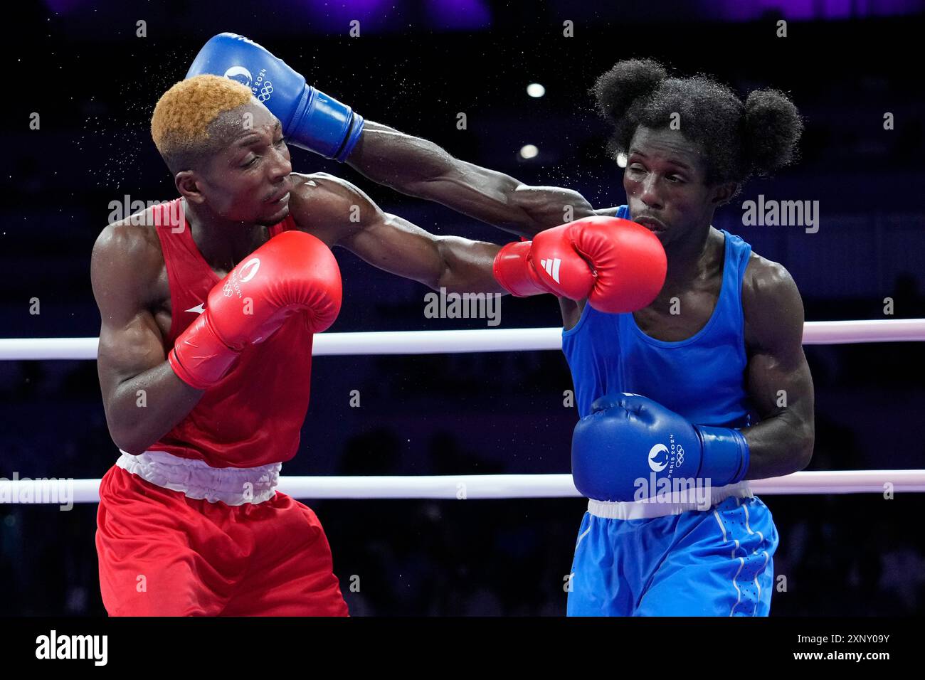 Zambia's Patrick Chinyemba exchanges punches with Cabo Verde's David De Pina in their men's 51 ...