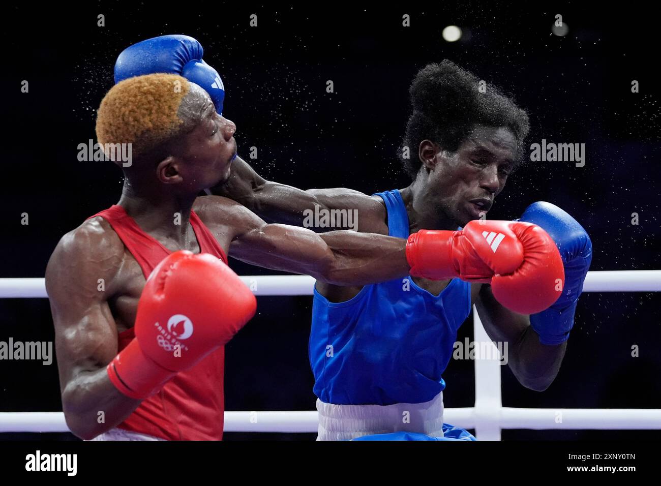 Zambia's Patrick Chinyemba exchanges punches with Cabo Verde's David De Pina in their men's 51 ...