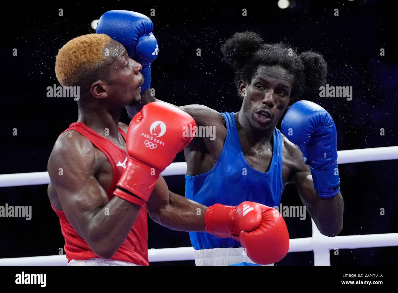 Cabo Verde's David De Pina hits Zambia's Patrick Chinyemba in their men ...