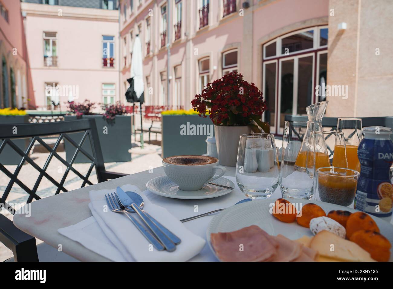 Elegant breakfast table at a high-end hotel with cappuccino, juices ...