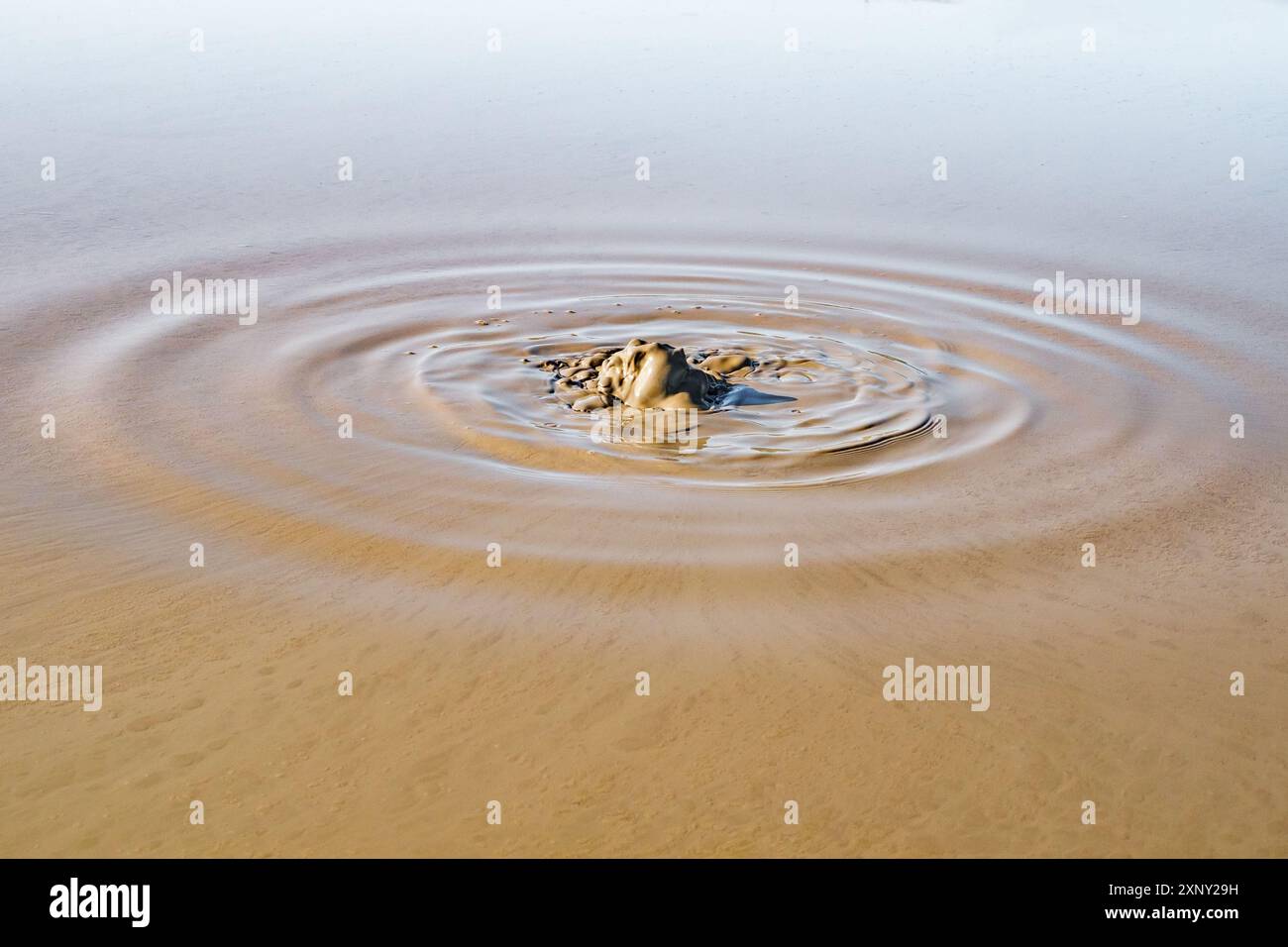 bubbling escaping gas on surface of mud lake Stock Photo - Alamy