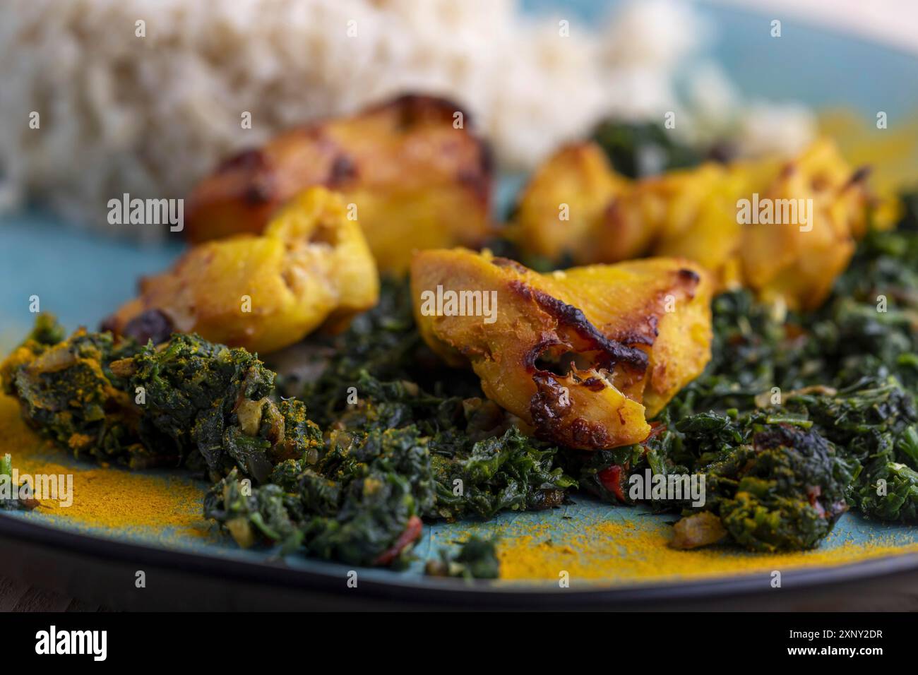 Indian murgh palak dish with rice Stock Photo - Alamy