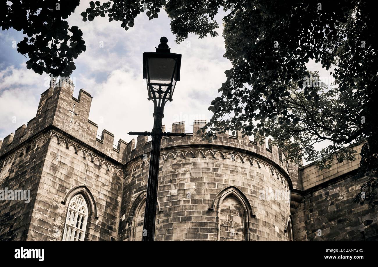 Silhouetted victorian lamp post set against the wall of Lancaster ...