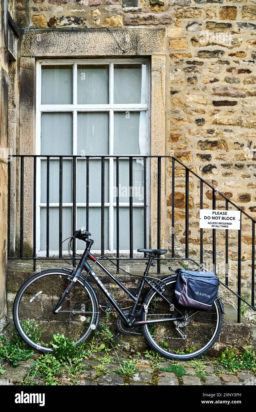 Bicycle against metal railings on stone steps Stock Photo - Alamy