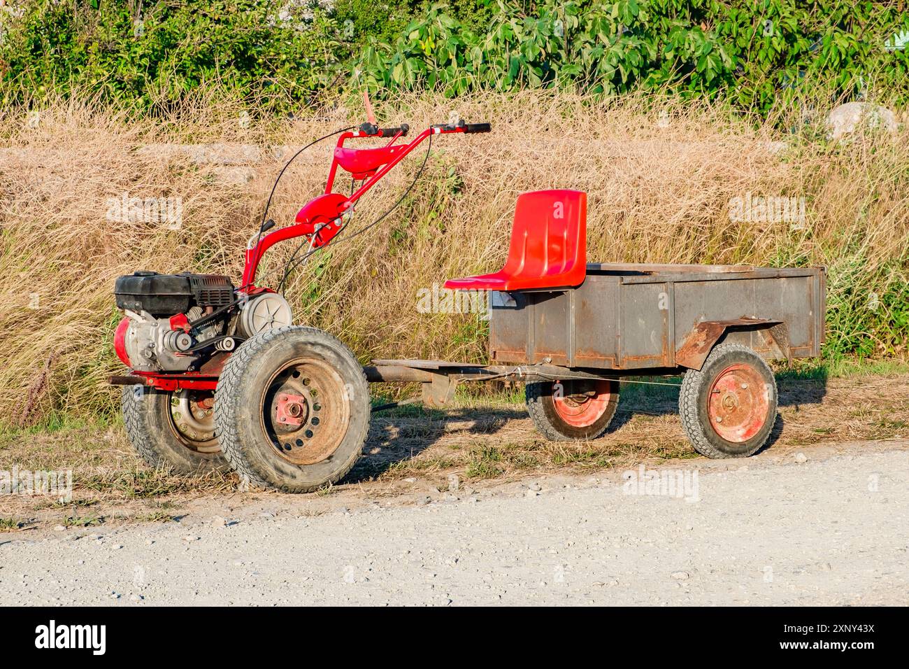 tillerblock with seat and trailer Stock Photo - Alamy
