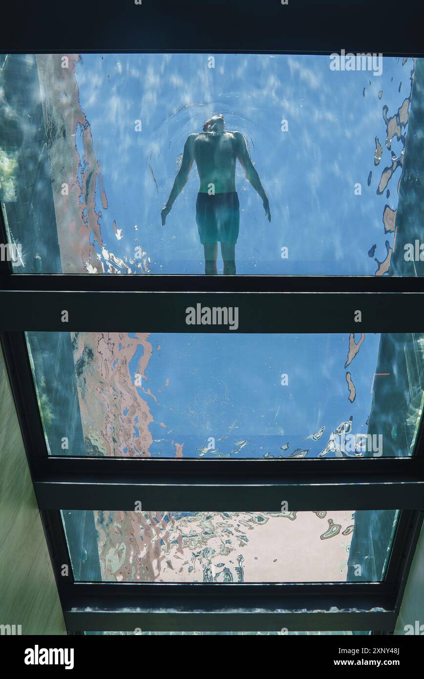 Person Swimming in Transparent Glass Bottom Pool at Luxury Hotel Stock ...