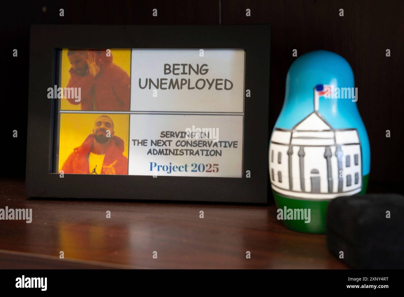 A Project 2025 meme and a depiction of the White House are seen on a ...