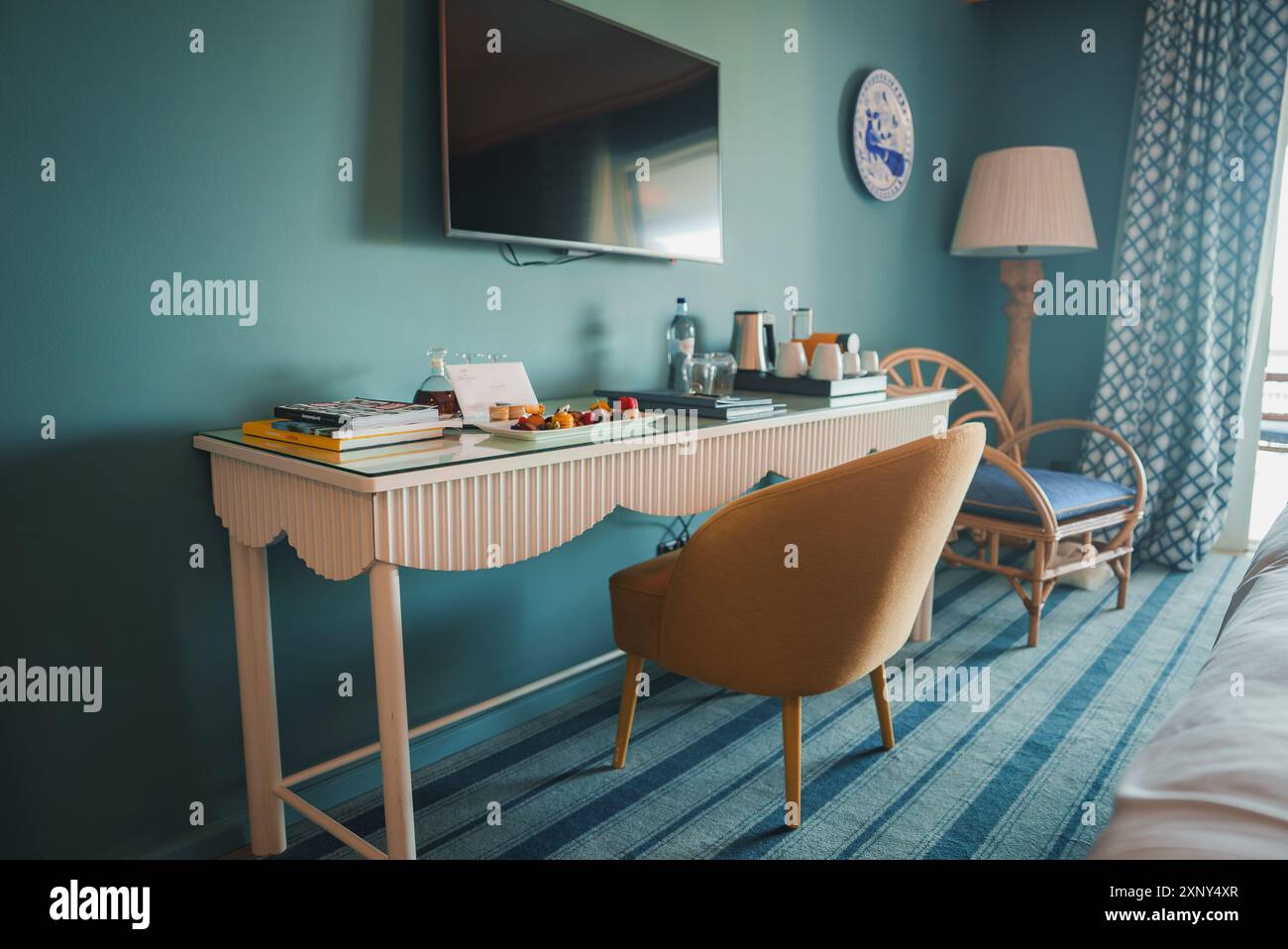 Luxurious Hotel Room with Modern Coastal Decor and Well-Appointed Desk ...