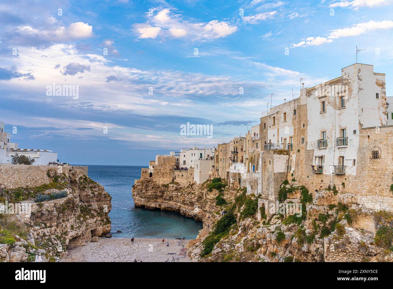 The beach of Polignano a Mare with its steep cliffs of the old town ...