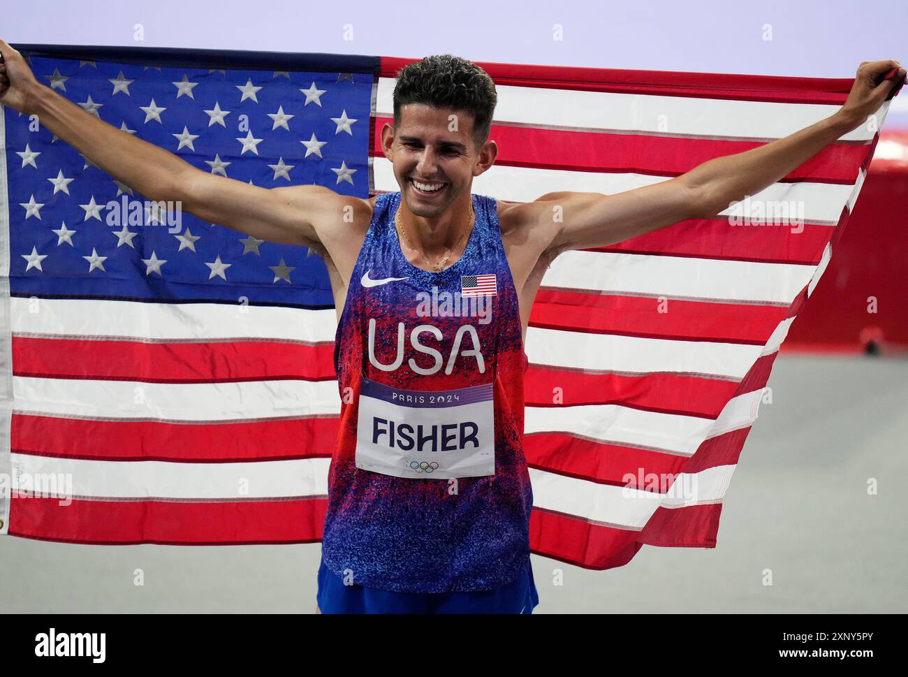 Grant Fisher of the U.S. celebrates after winning the bronze medal in ...