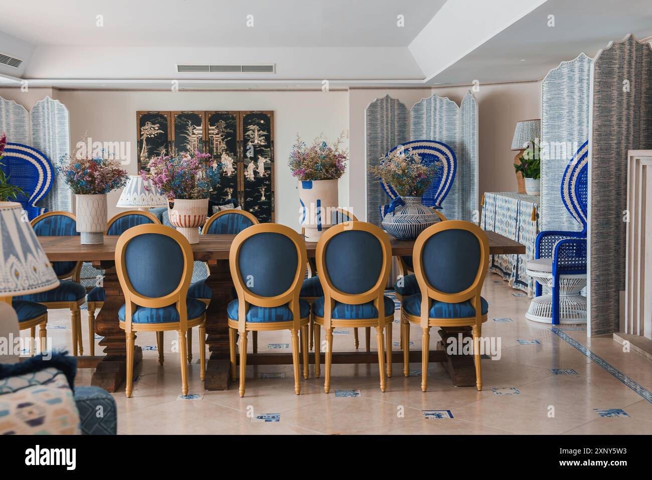 Luxurious Dining Area with Elegant Blue Upholstered Chairs and Golden ...