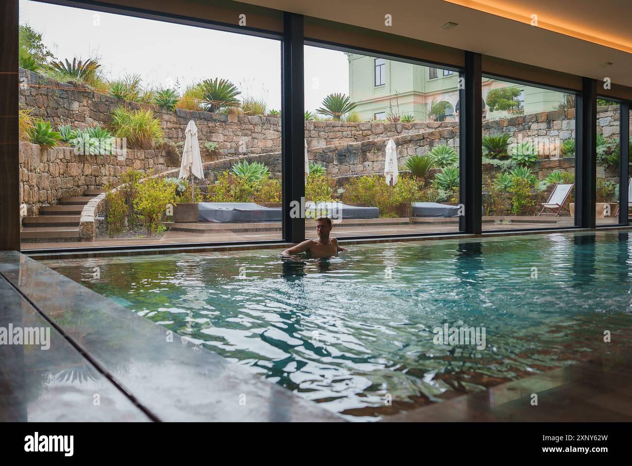 Luxurious Indoor Swimming Pool with Garden View at High-End Resort ...