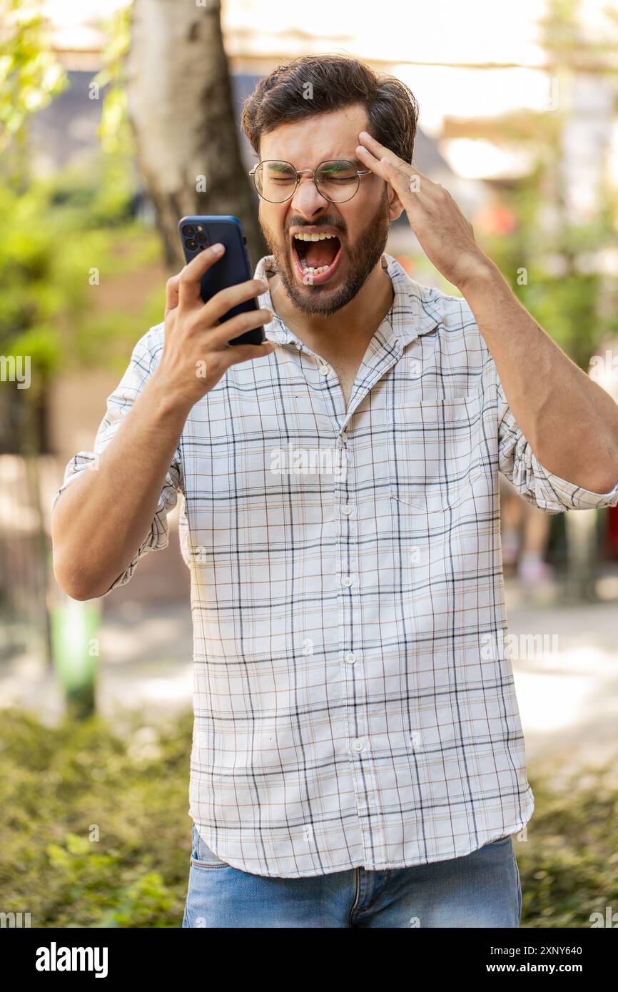 Offended guy talking on smartphone hi-res stock photography and images ...