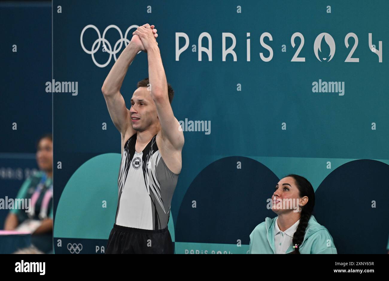 LITVINOVICH Ivan of Individual Neutral Athletes reacts after performing ...