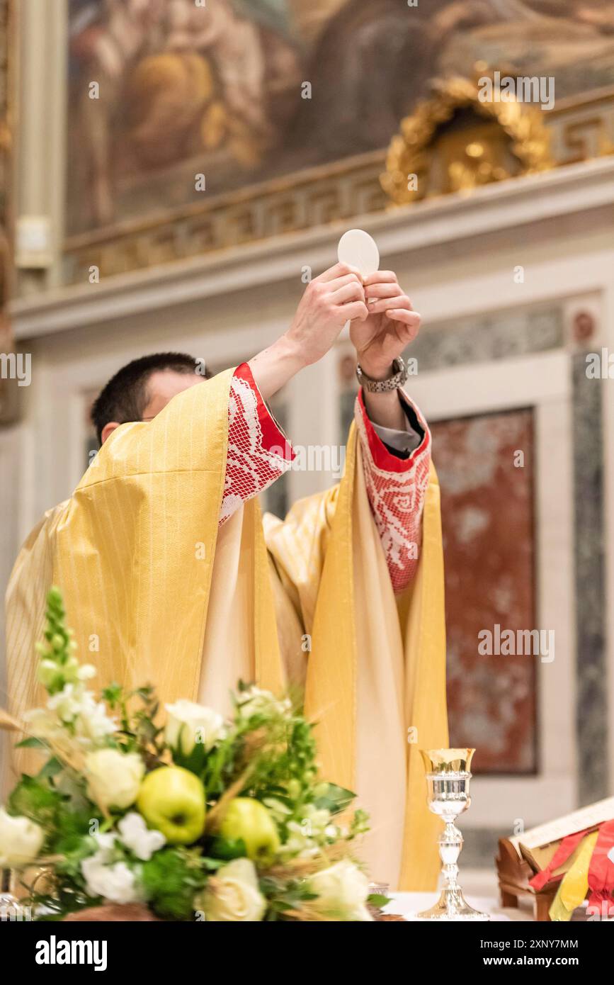 The elevation of the Sacramental Bread during the catholic liturgy ...