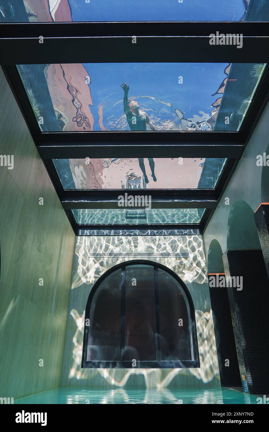 Glass-Bottom Pool Suspended Above Indoor Space in Luxury Hotel with ...
