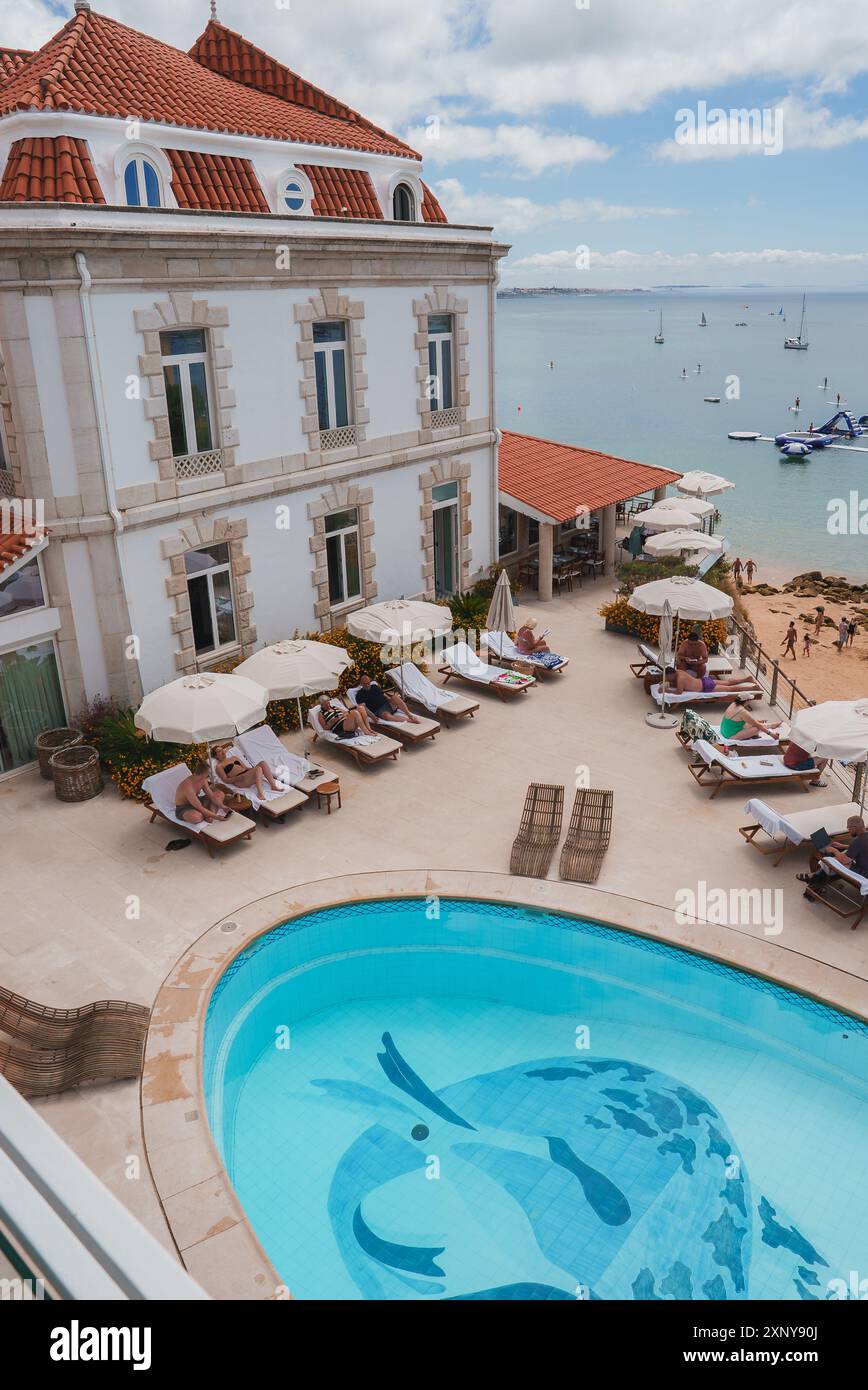 A high-end coastal resort featuring a serene beach, clear blue waters ...