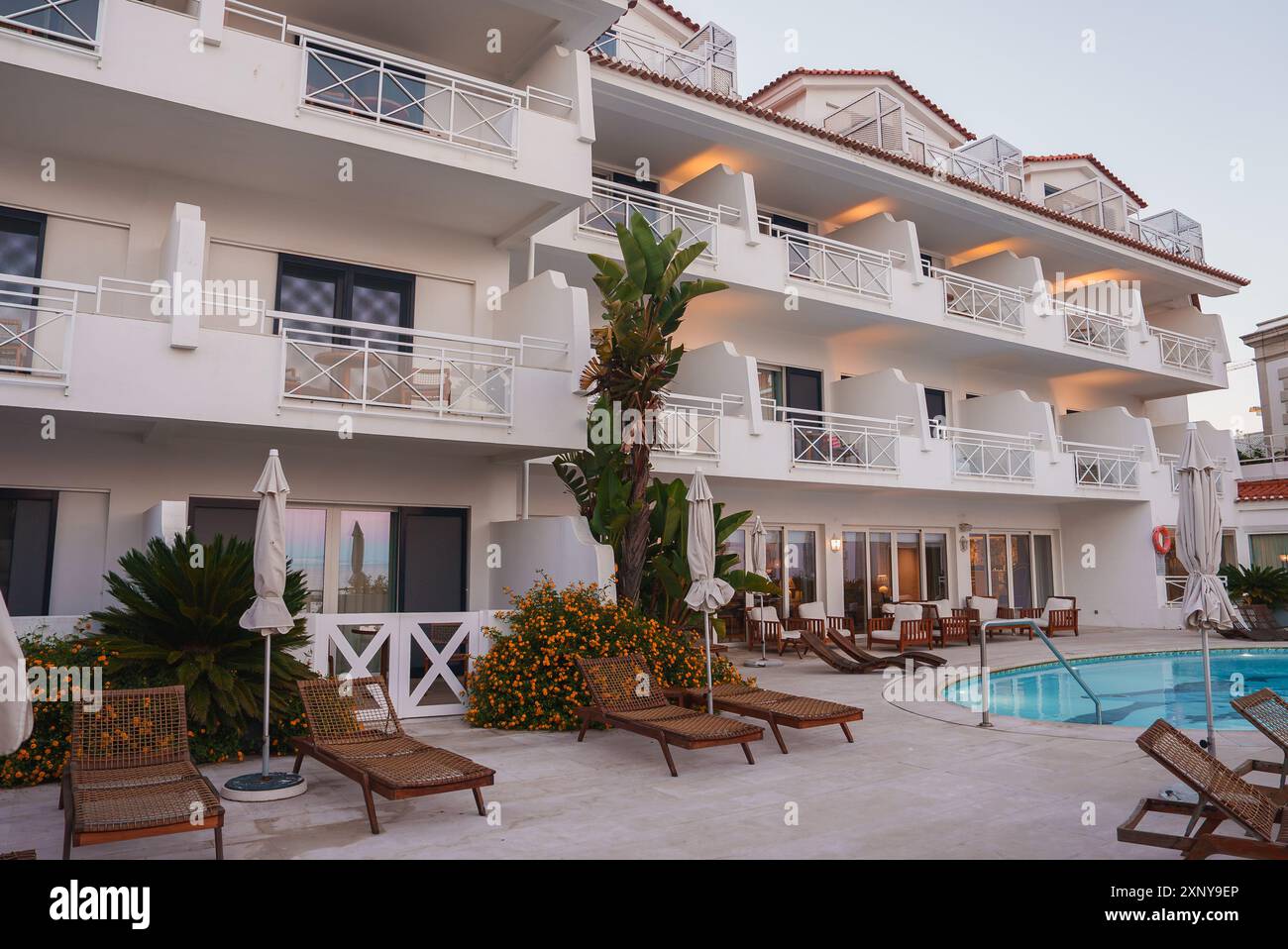 Elegant Multi-Story Luxury Hotel with Pool and Tropical Landscaping ...