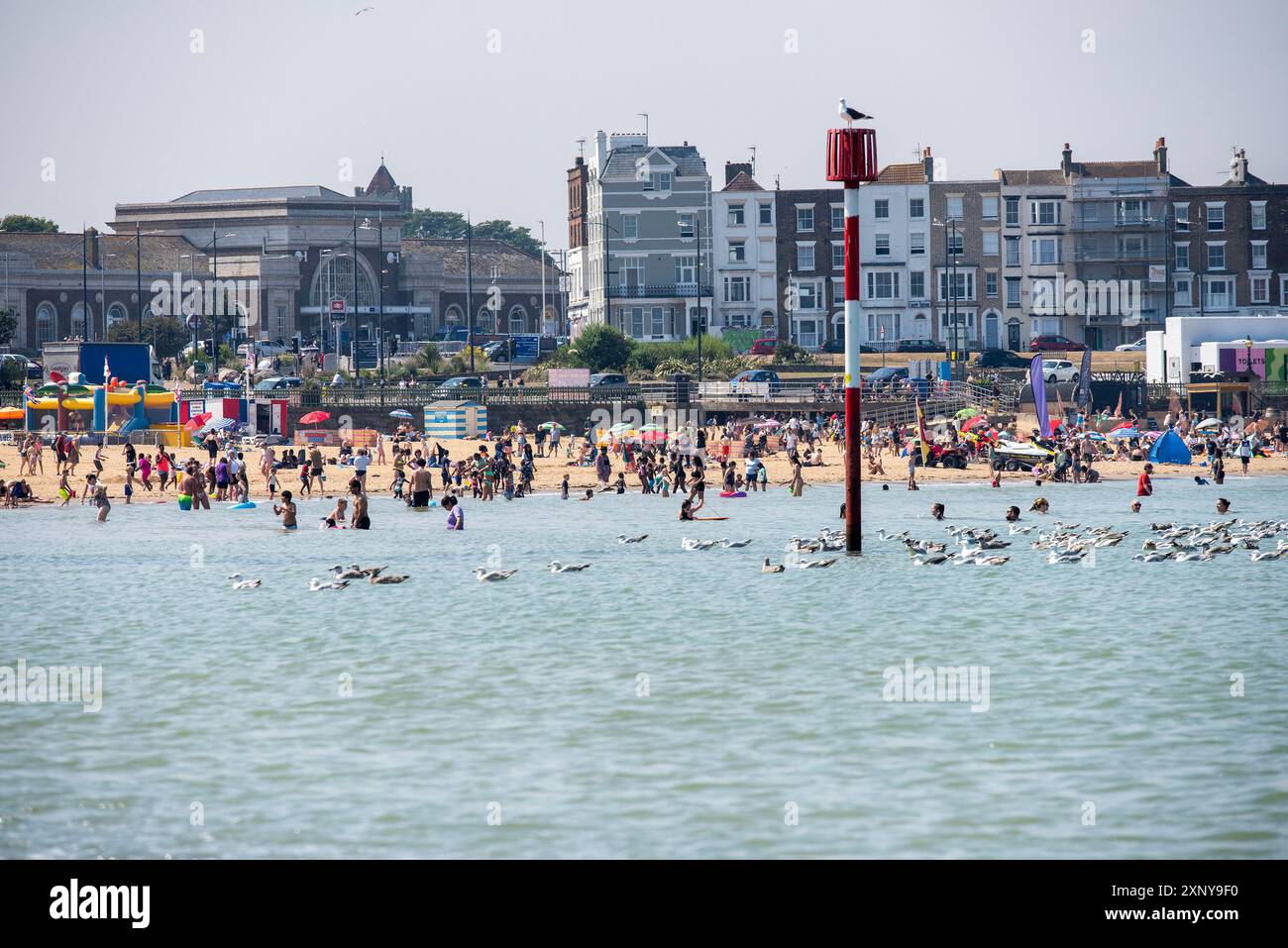 People enjoy the sunshine and the water on the Margate Beach. Another ...